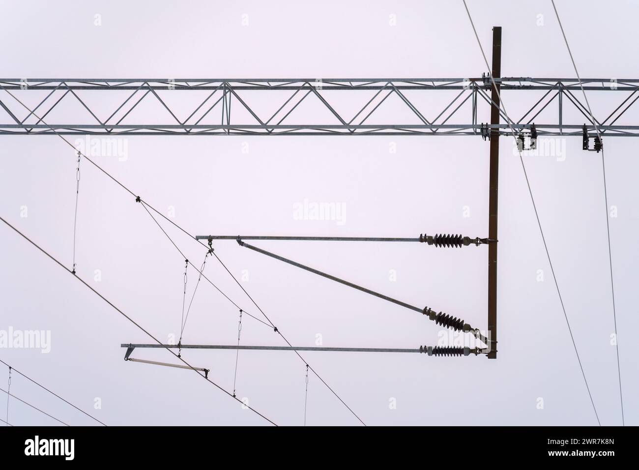 Overhead Electric Lines Against a Cloudy Sky for Railway Power Supply Stock Photo - Alamy