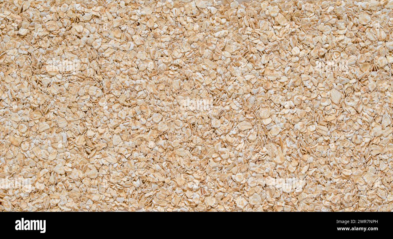 Uncooked oat flakes. Oatmeal texture. Rolled oats background. Close up ...