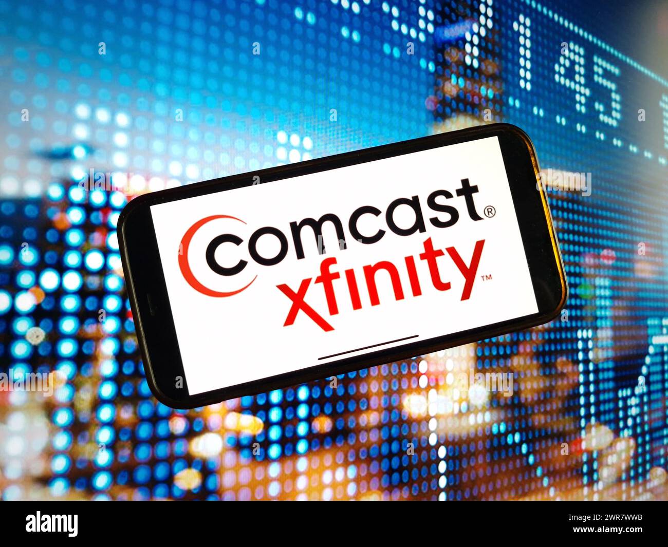 In this photo illustration, the Comcast Xfinity company logo is seen ...