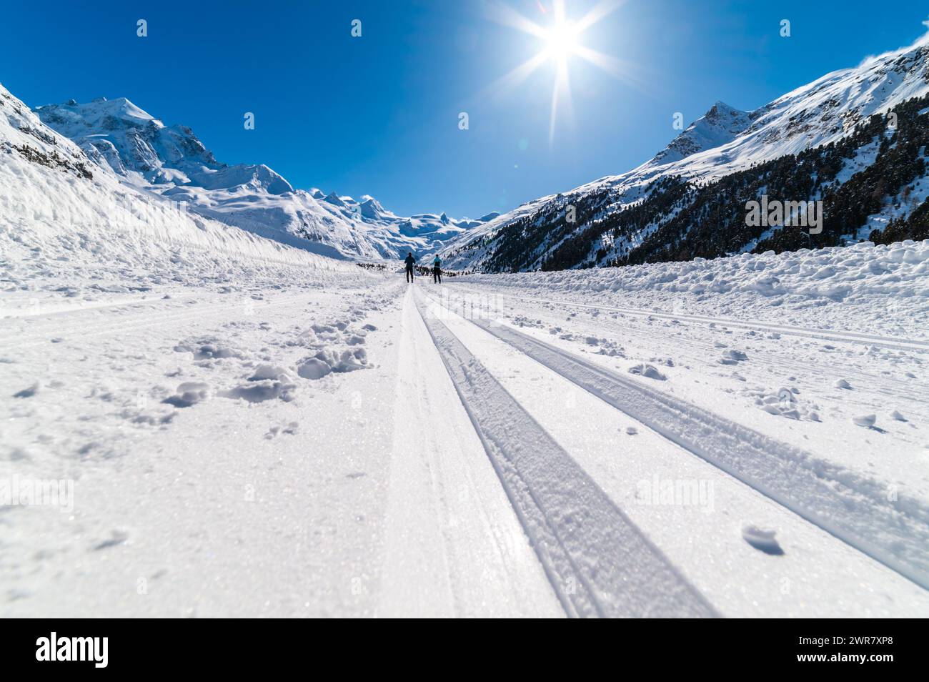 Val Roseg, in Engadine, Switzerland, in winter, with snow-covered cross ...
