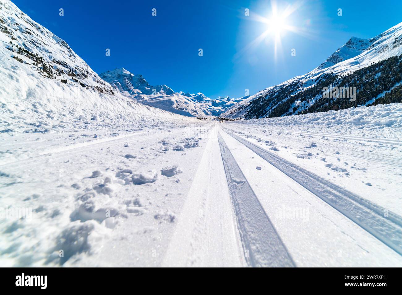 Val Roseg, in Engadine, Switzerland, in winter, with snow-covered cross ...