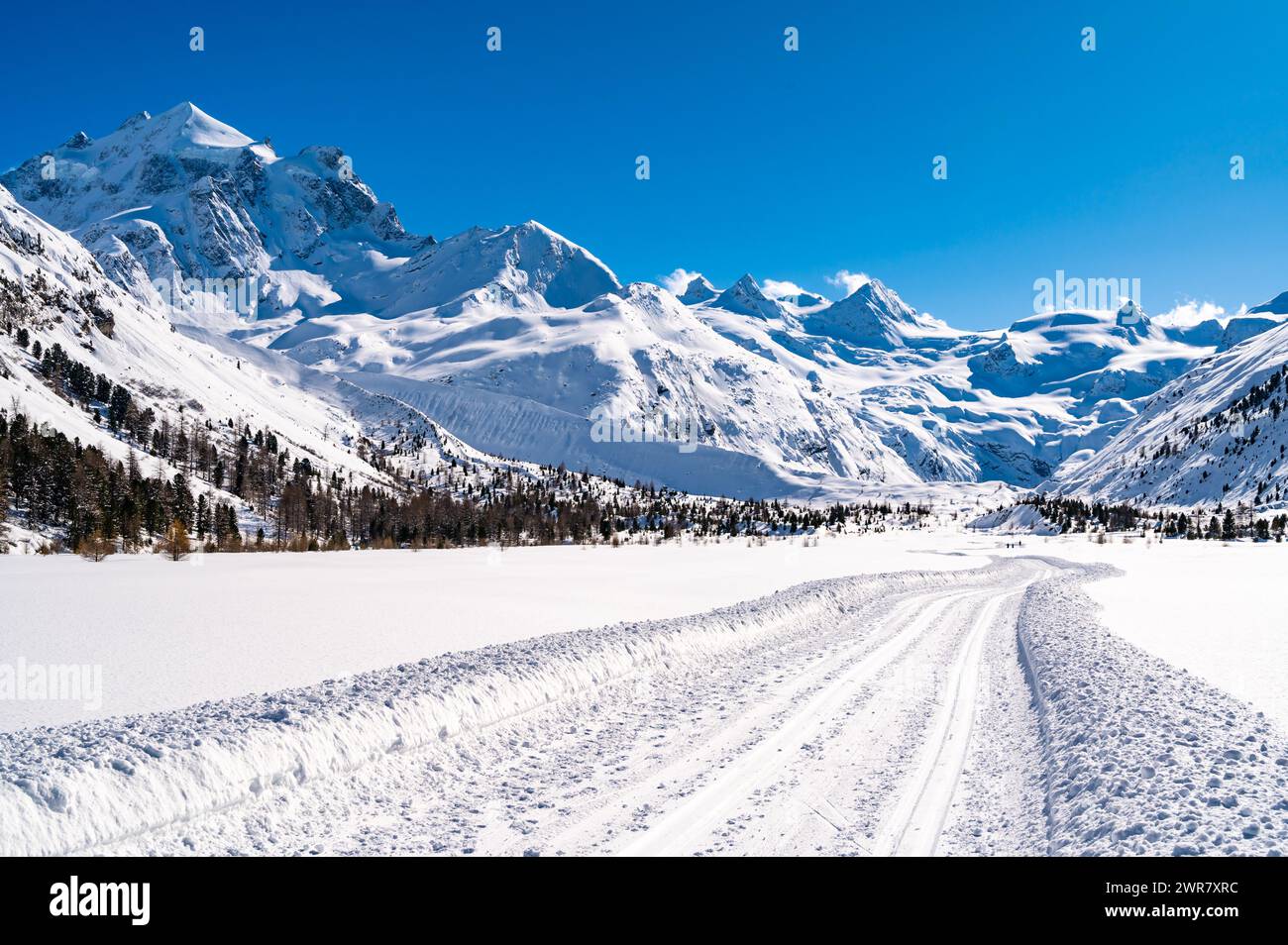 Val Roseg, in Engadine, Switzerland, in winter, with snow-covered cross ...