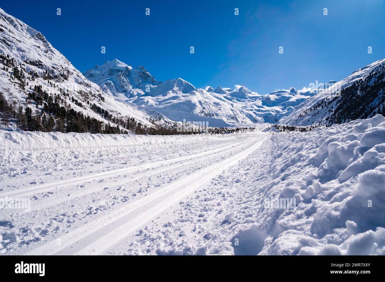 Val Roseg, in Engadine, Switzerland, in winter, with snow-covered cross ...