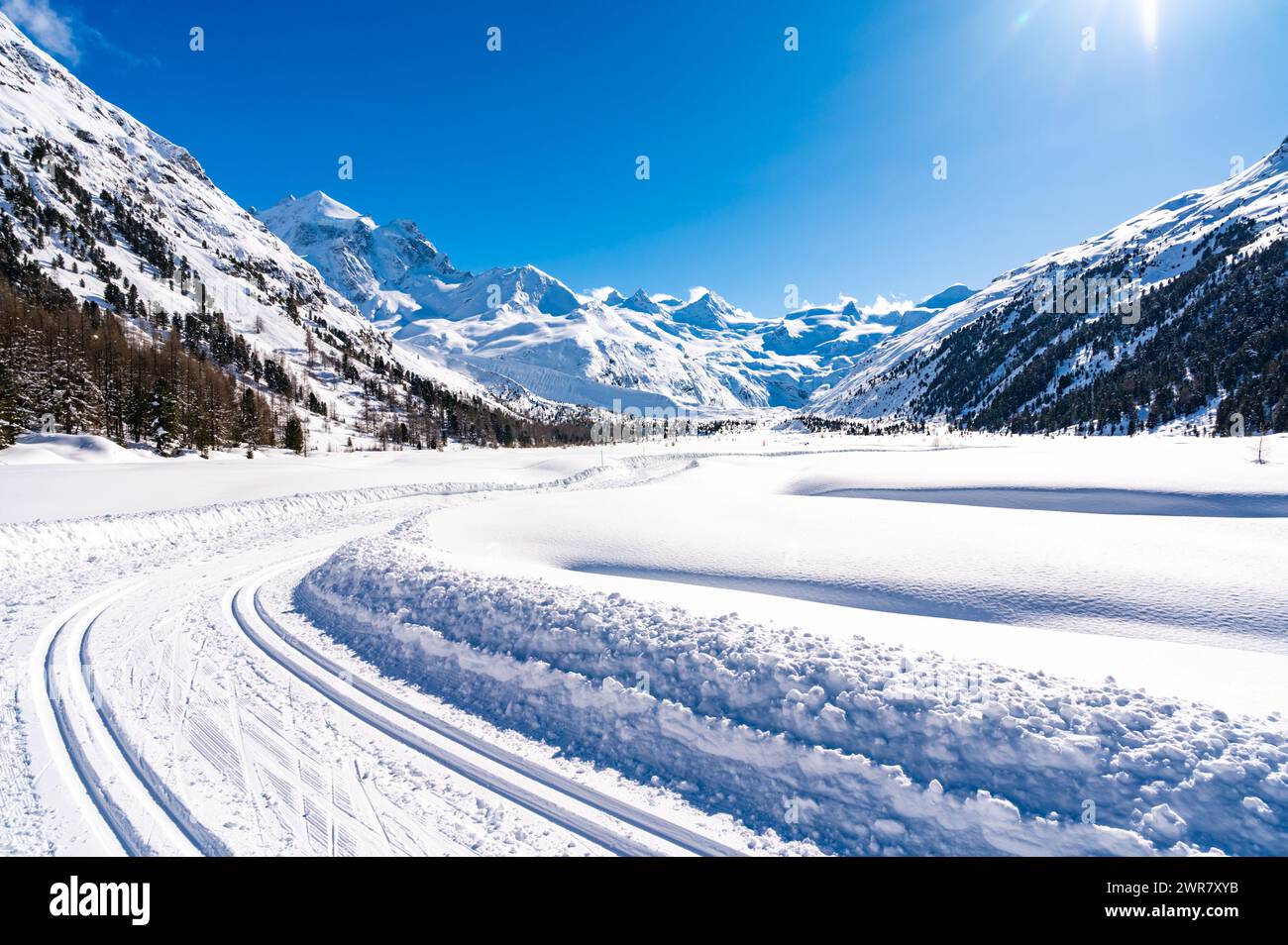 Val Roseg, in Engadine, Switzerland, in winter, with snow-covered cross ...
