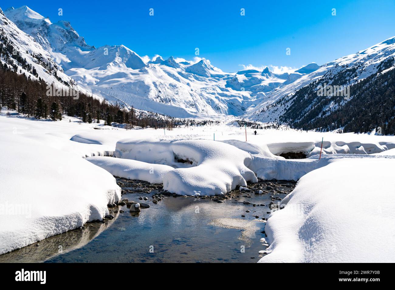Val Roseg, in Engadine, Switzerland, in winter, with snow-covered cross ...