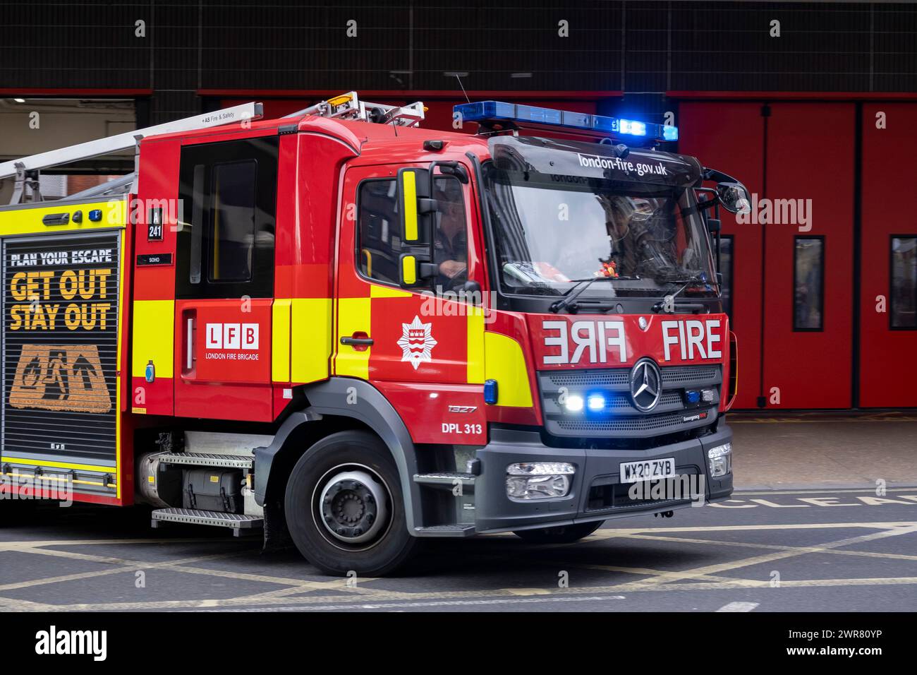 London Fire Brigade fire engine exiting the fire station in Soho on ...