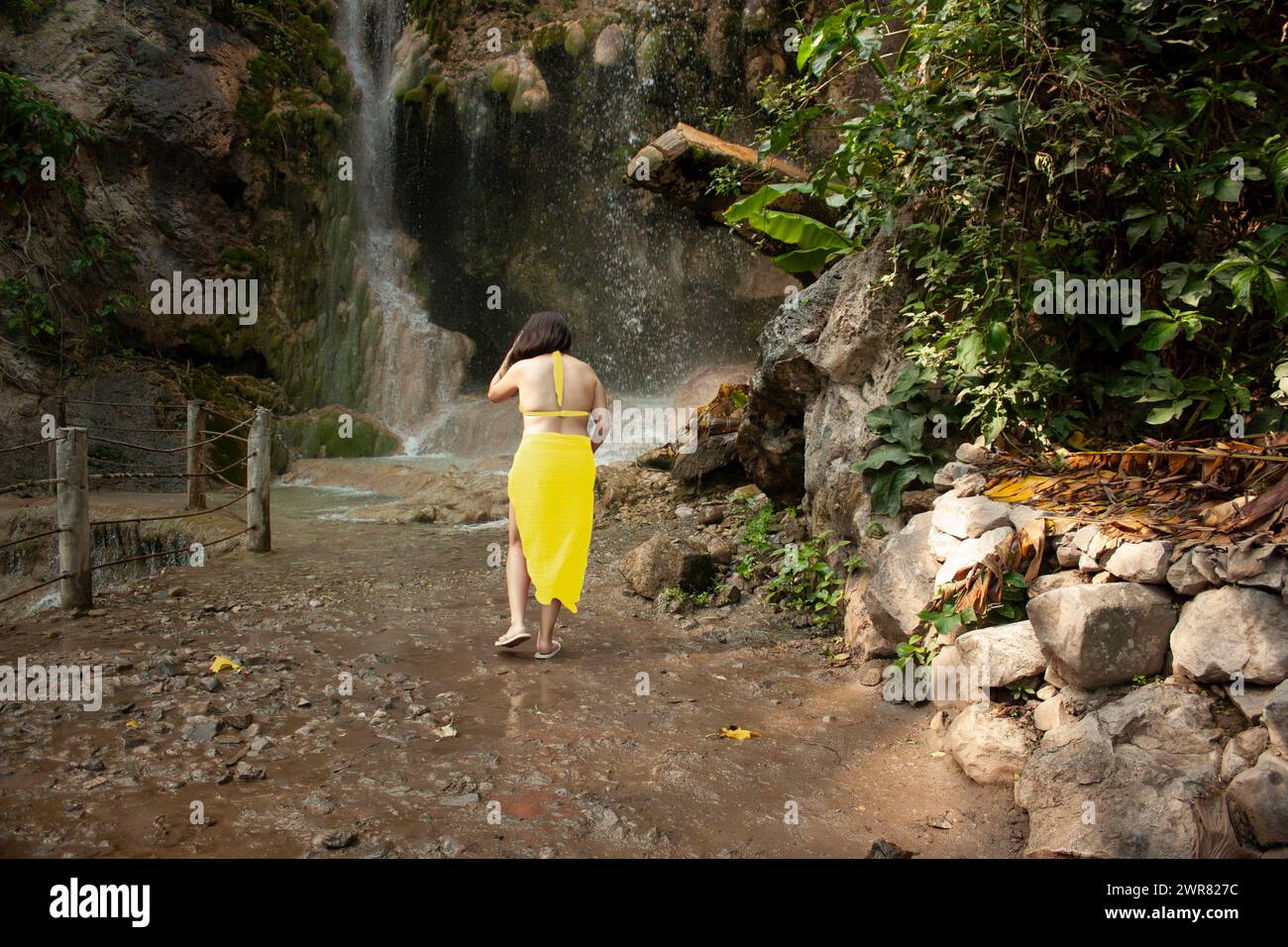 Pretty woman using yellow pareo and vikiny inside Hidalgo Mexico Stock ...