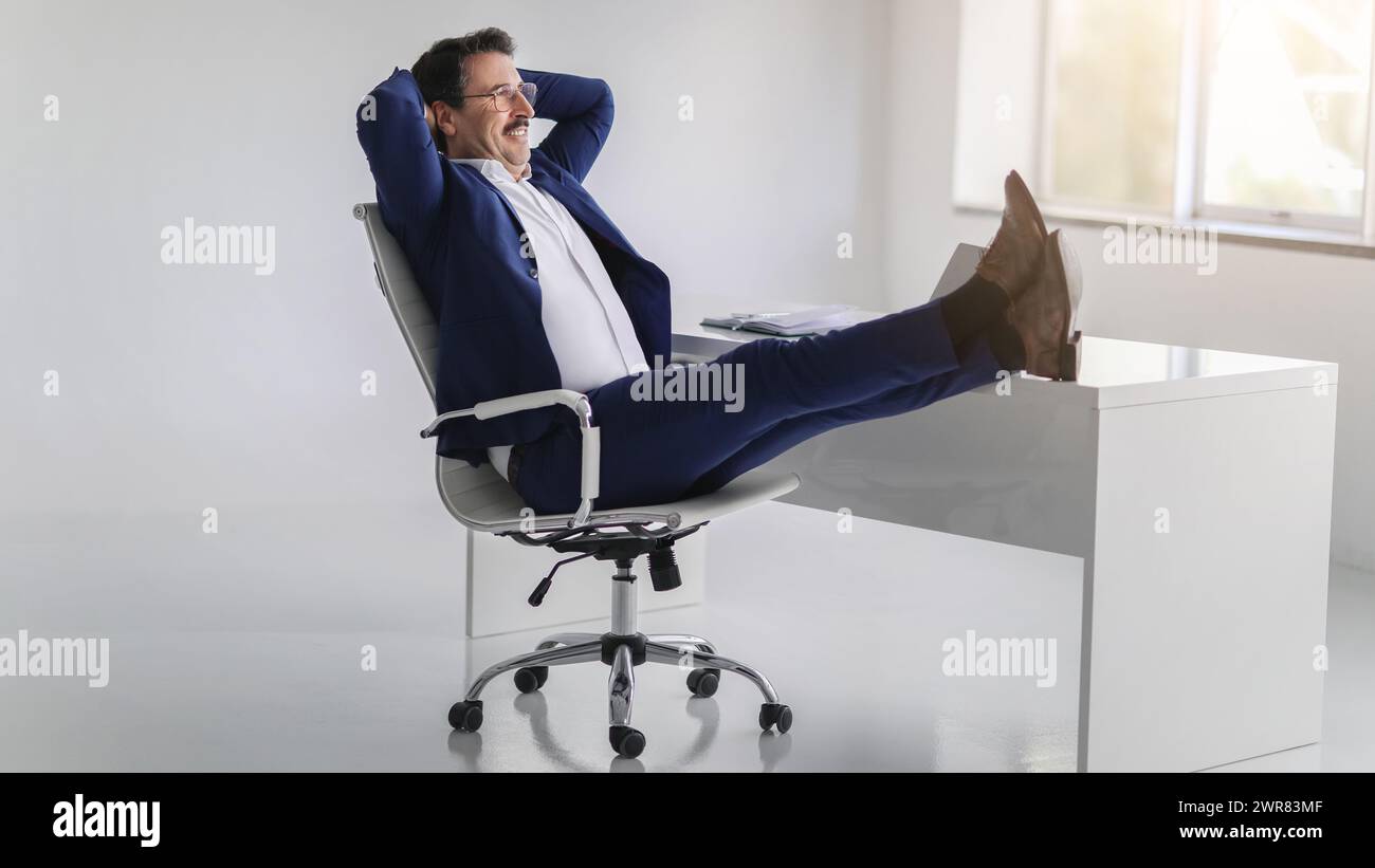 Businessman desk office leaning back hi-res stock photography and ...