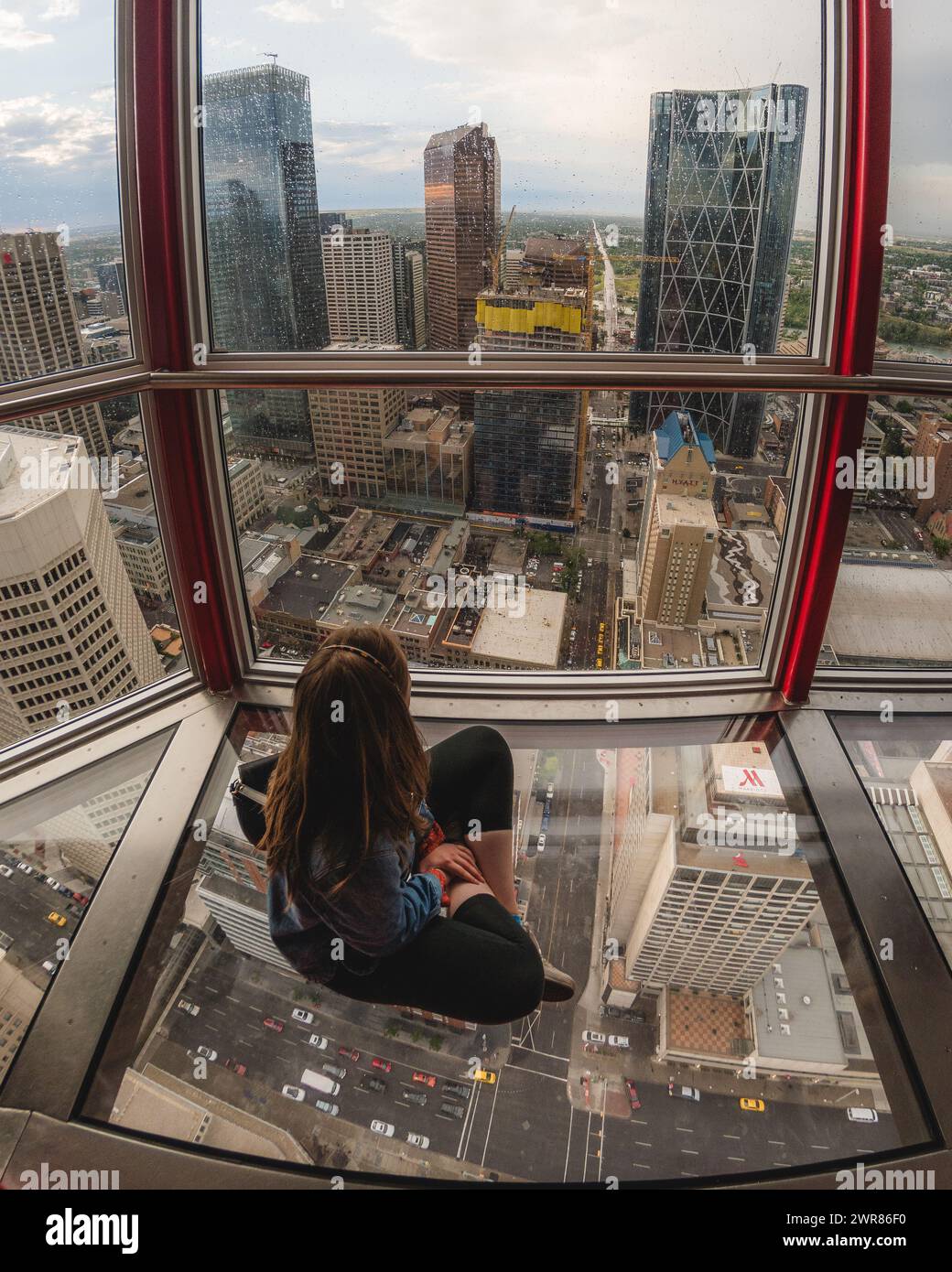 My wife sitting down at the Calgary Tower watching the sun set. Shot sometime in 2017 Stock ...
