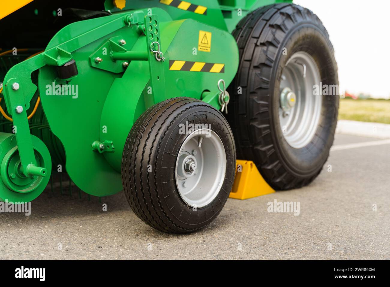 A detailed view of a green and yellow tractor, showcasing its vibrant ...