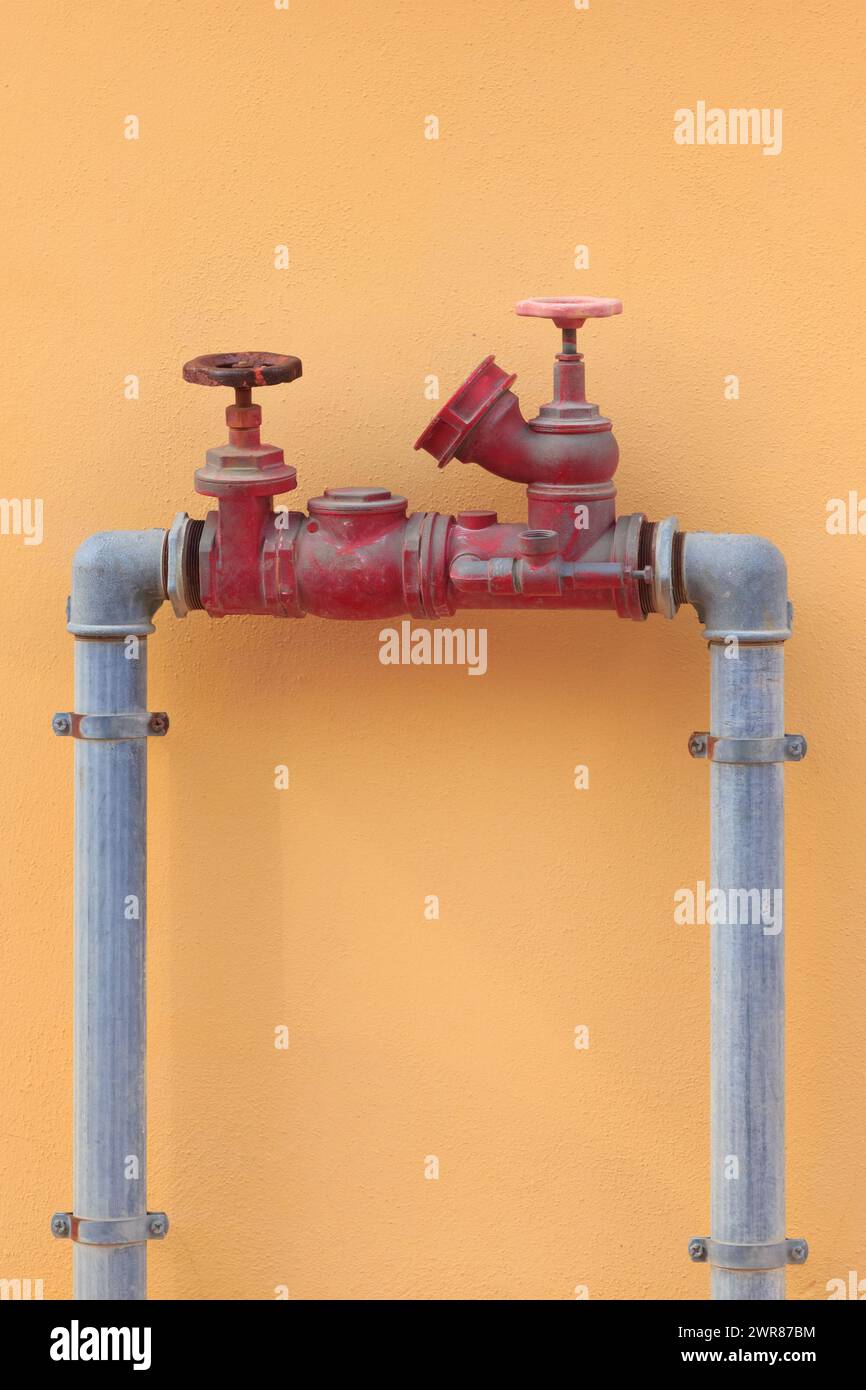 The Outdoor Water Hydrant. Red Pipe With Valve Equipment Stock Photo ...