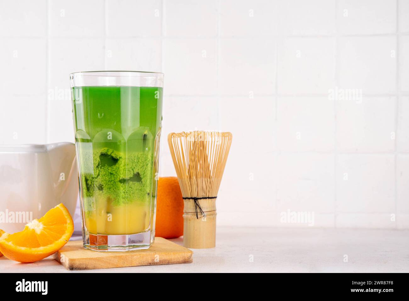 Orange Matcha Lemonade, Cold asia fruit cocktail with green matcha and ...