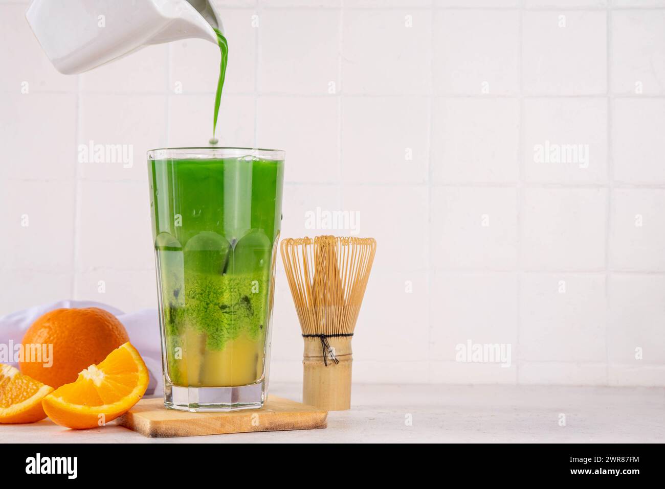 Orange Matcha Lemonade, Cold asia fruit cocktail with green matcha and ...