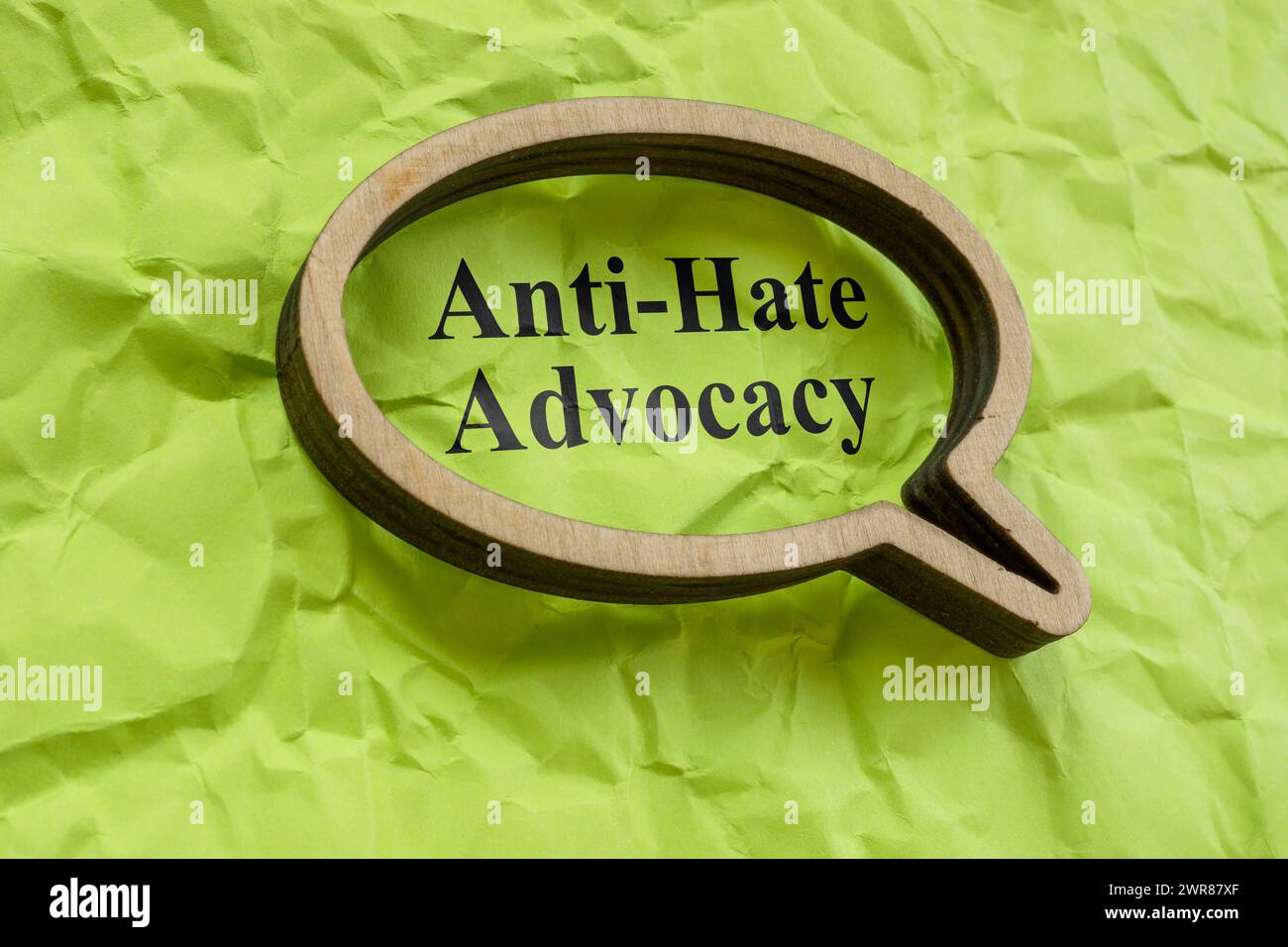 Crumpled green paper with an inscription Anti-hate advocacy and speech ...