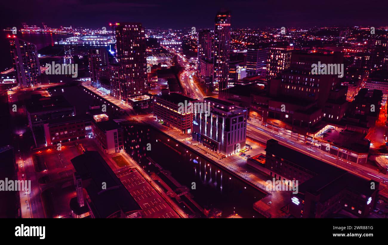 Aerial night view of a bustling cityscape with illuminated streets and ...
