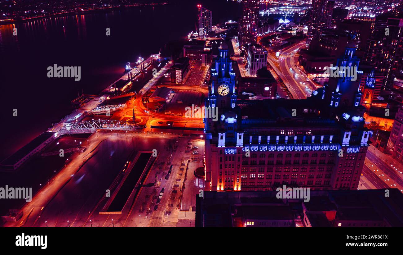 Aerial night view of a cityscape with illuminated streets and buildings ...