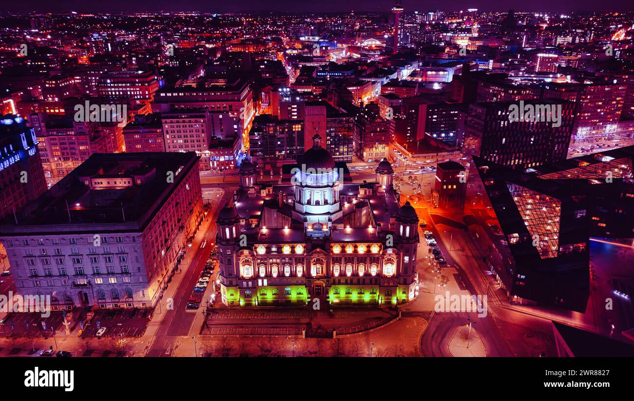 Aerial night view of a vibrant cityscape with illuminated buildings and ...
