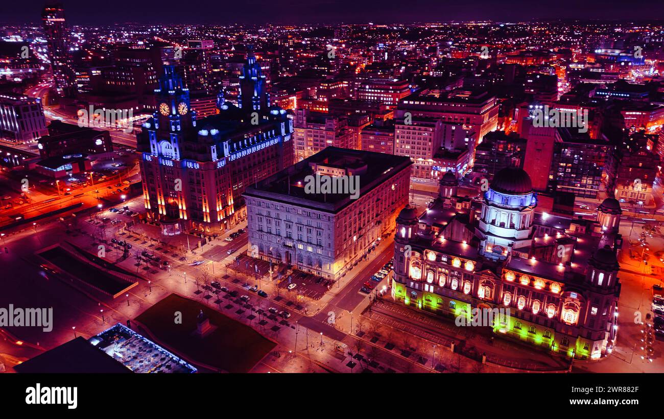 Aerial night view of a vibrant cityscape with illuminated buildings and ...