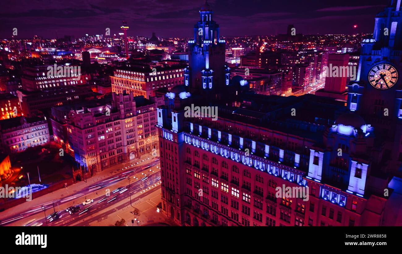 Aerial night view of a vibrant cityscape with illuminated buildings and ...