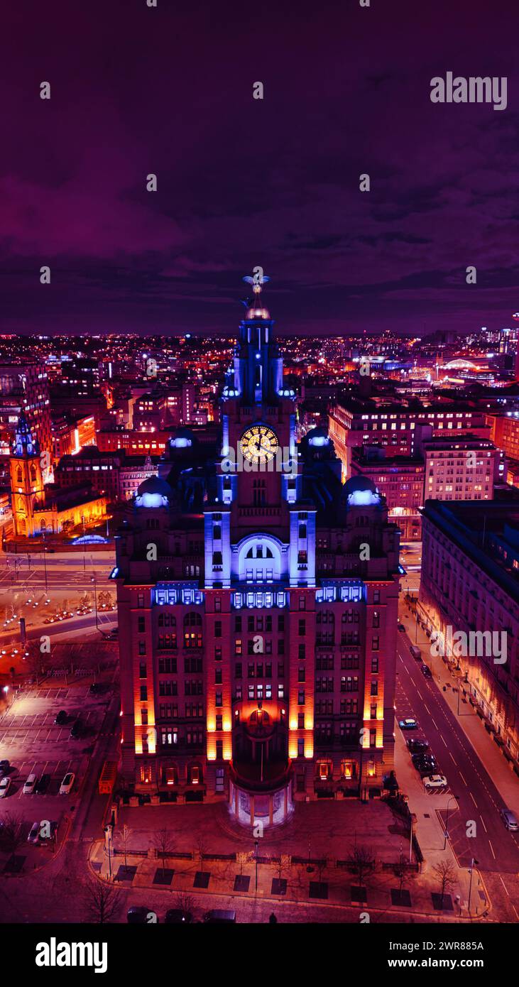 Aerial night view of an illuminated historic building in an urban ...