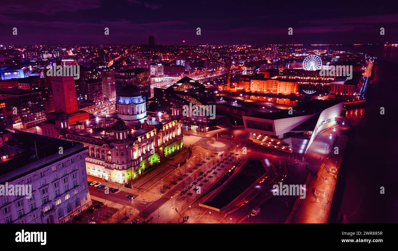 Aerial night view of a vibrant cityscape with illuminated streets and ...