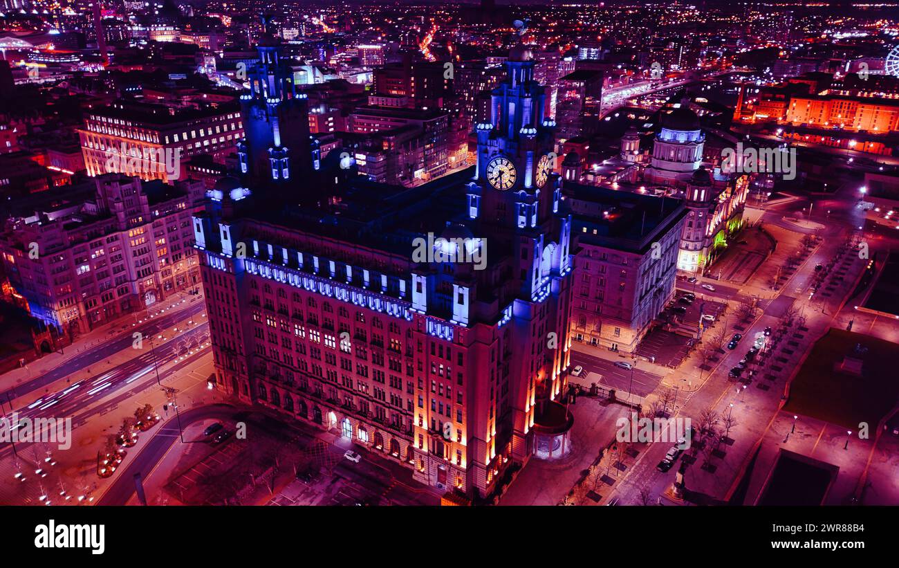 Aerial night view of an illuminated urban cityscape with historic ...