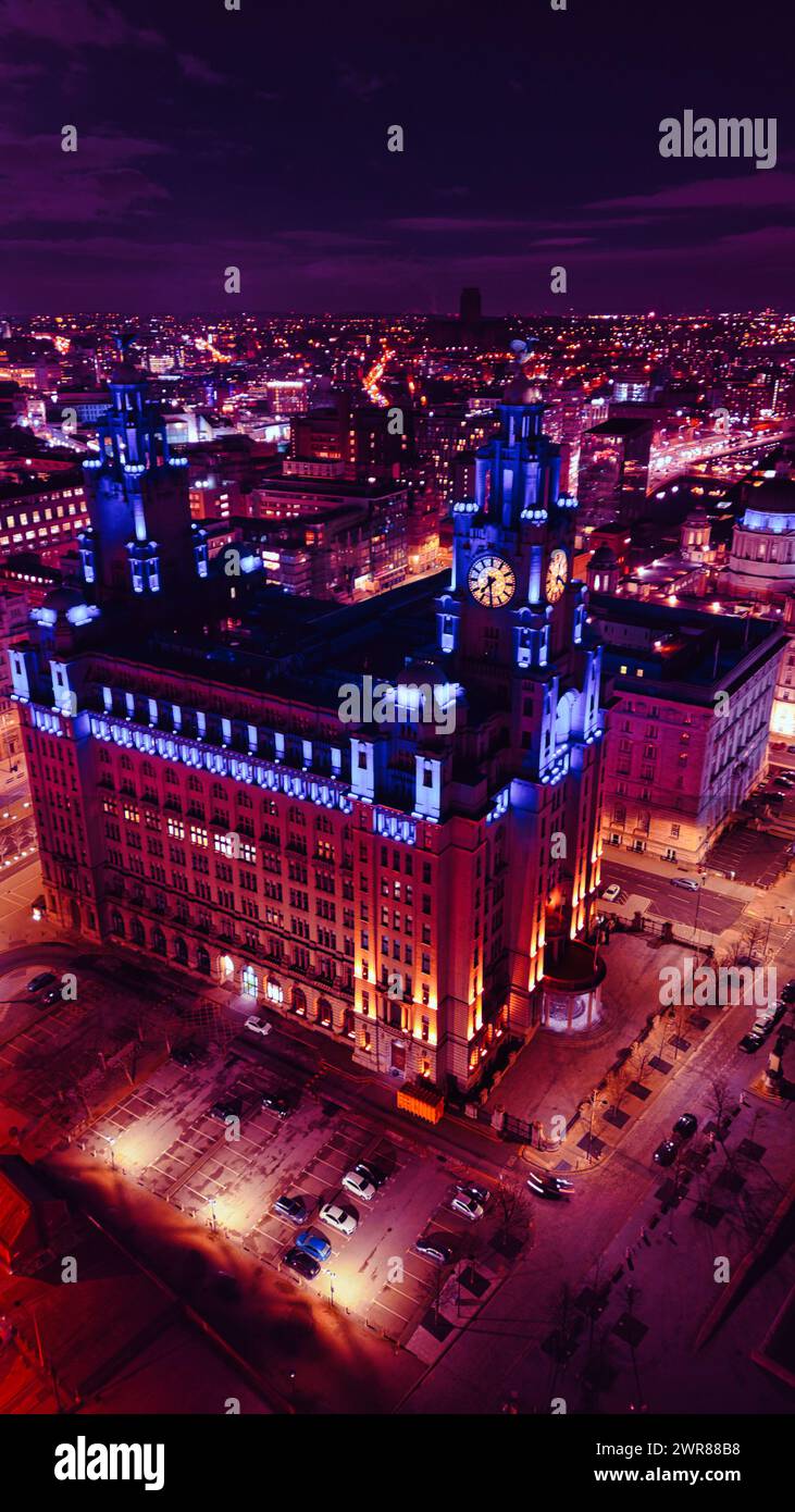 Aerial night view of an illuminated historic building in an urban ...