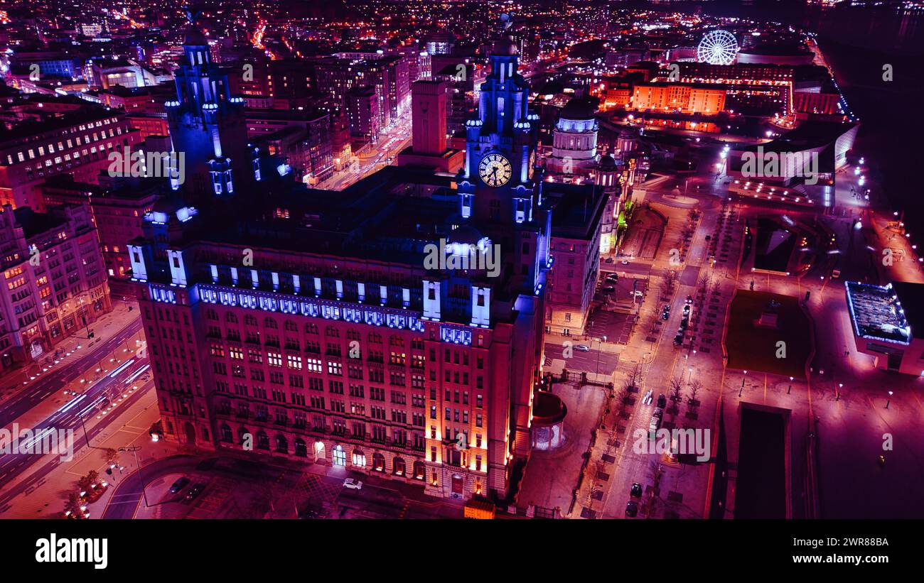Aerial night view of an illuminated urban cityscape with historic ...