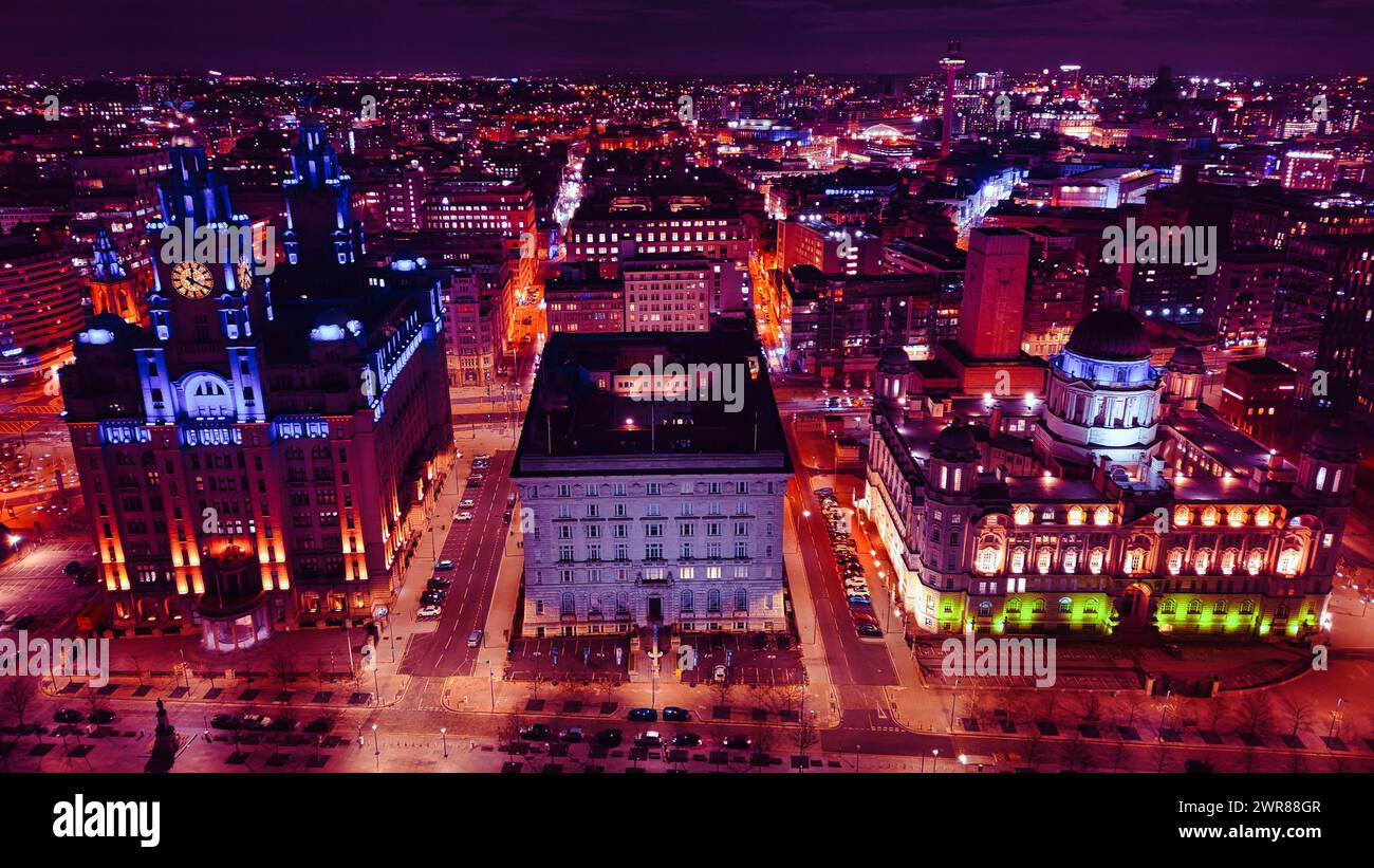 Aerial night view of a vibrant cityscape with illuminated buildings and ...