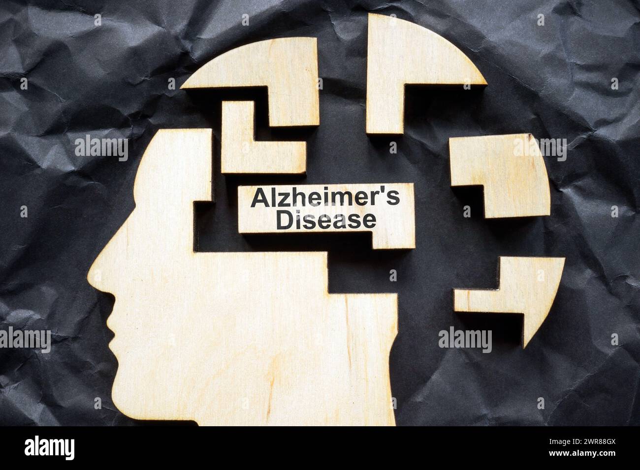 Alzheimer disease. Wooden model of a head made from parts Stock Photo ...