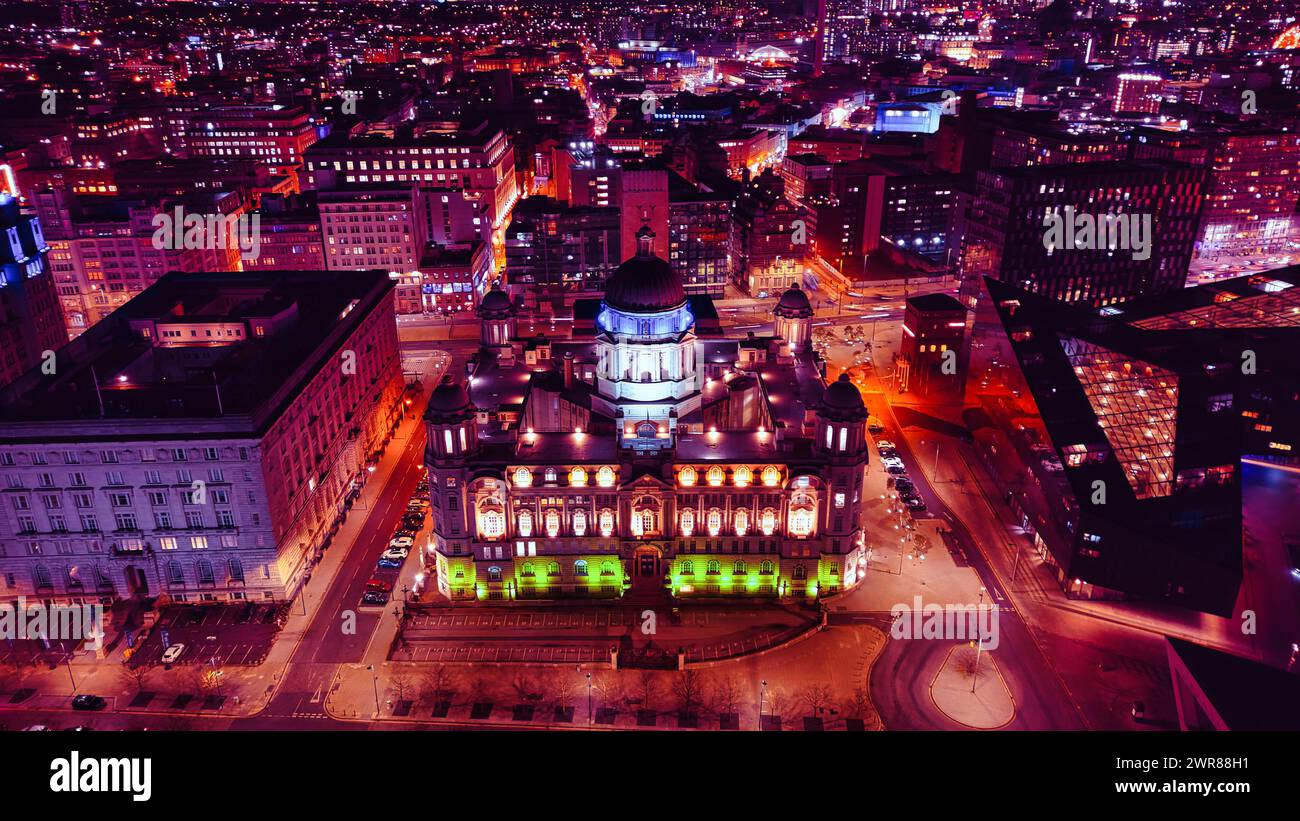 Aerial night view of an illuminated cityscape with historic ...