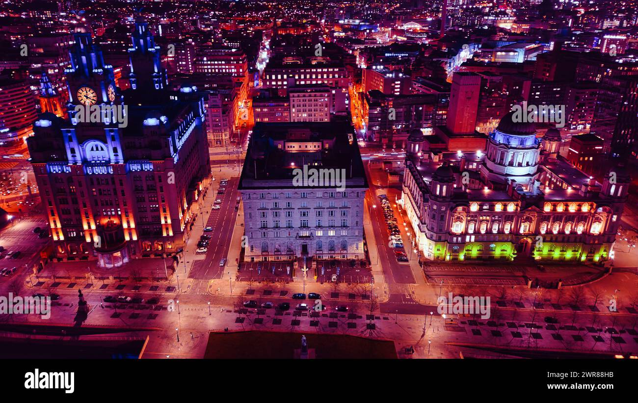 Aerial night view of a vibrant cityscape with illuminated buildings and ...