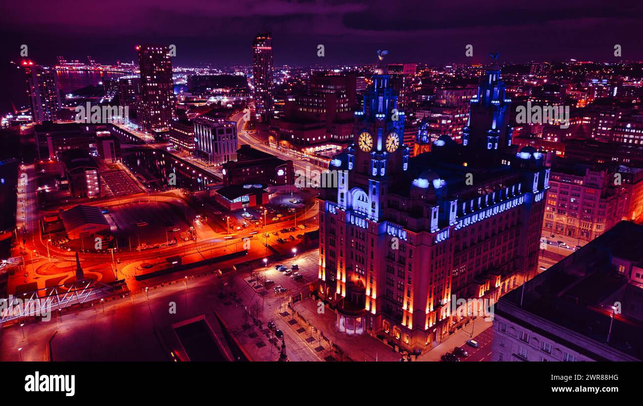 Night cityscape with illuminated buildings and streets, showcasing ...