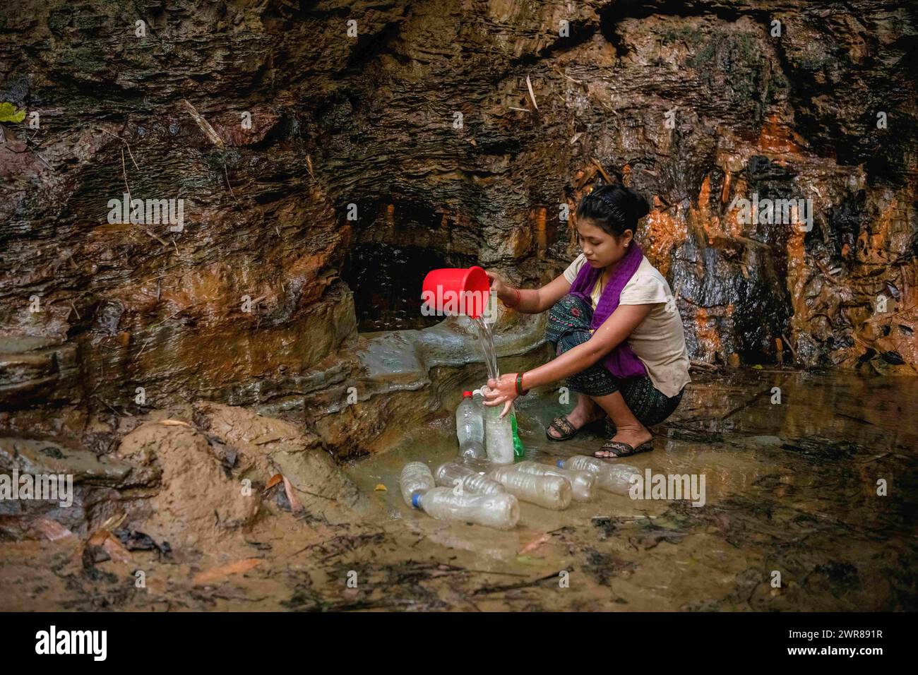 Bandarban, Bangladesh. 16th Jan, 2024. A Mro woman fetches drinking ...