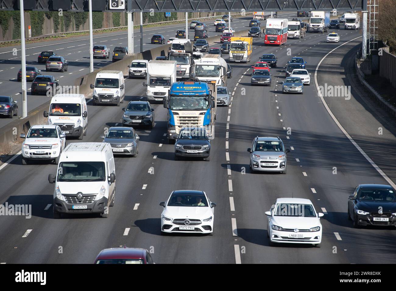 Egham, Surrey, UK. 4th March, 2024. Busy traffic on the M25 Motorway at ...