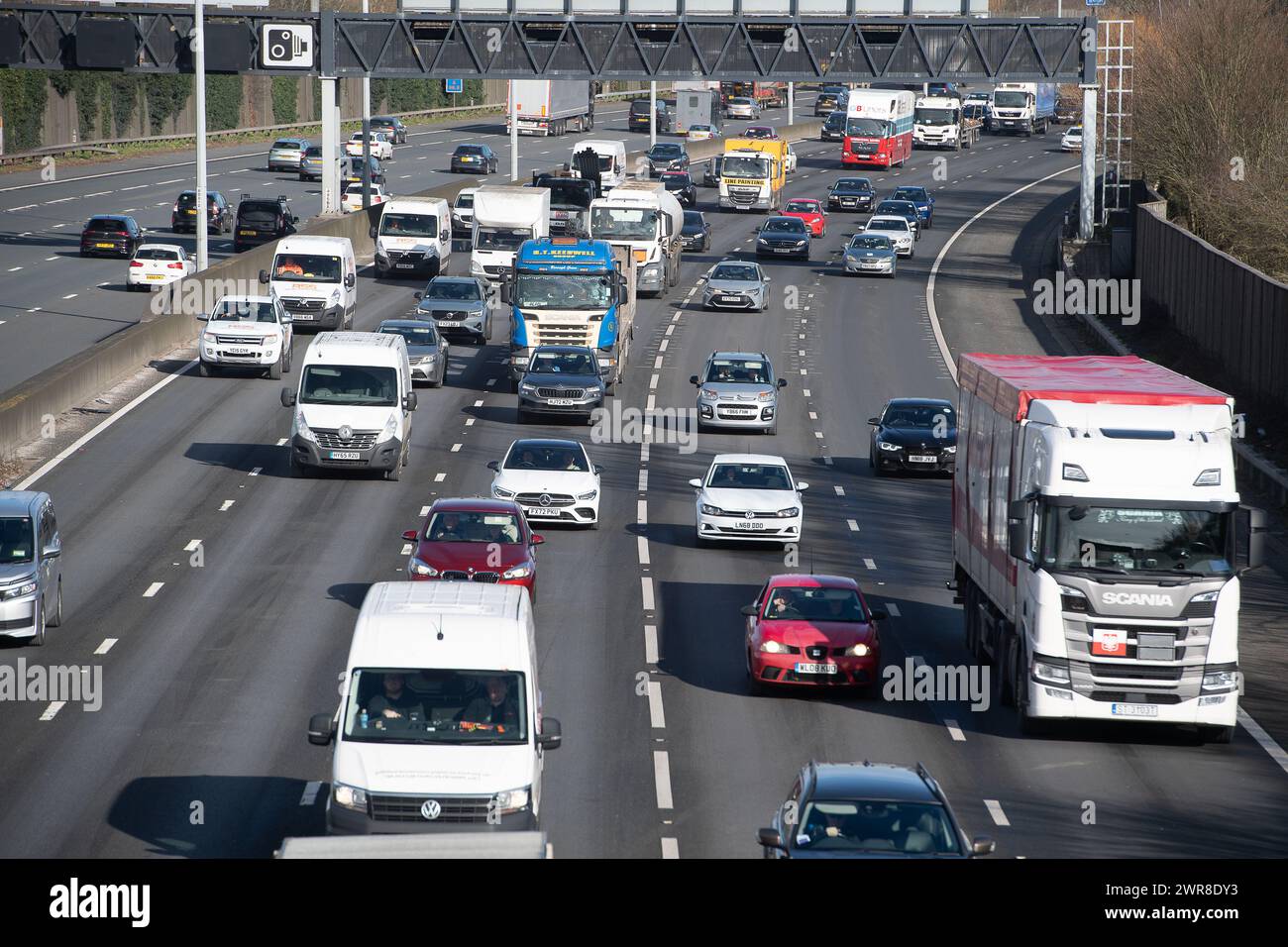 Egham, Surrey, UK. 4th March, 2024. Busy traffic on the M25 Motorway at ...