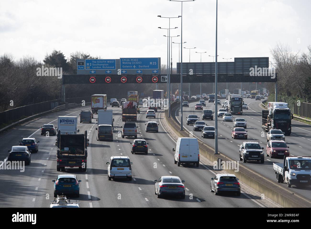 Egham, Surrey, UK. 4th March, 2024. Busy traffic on the M25 Motorway at ...