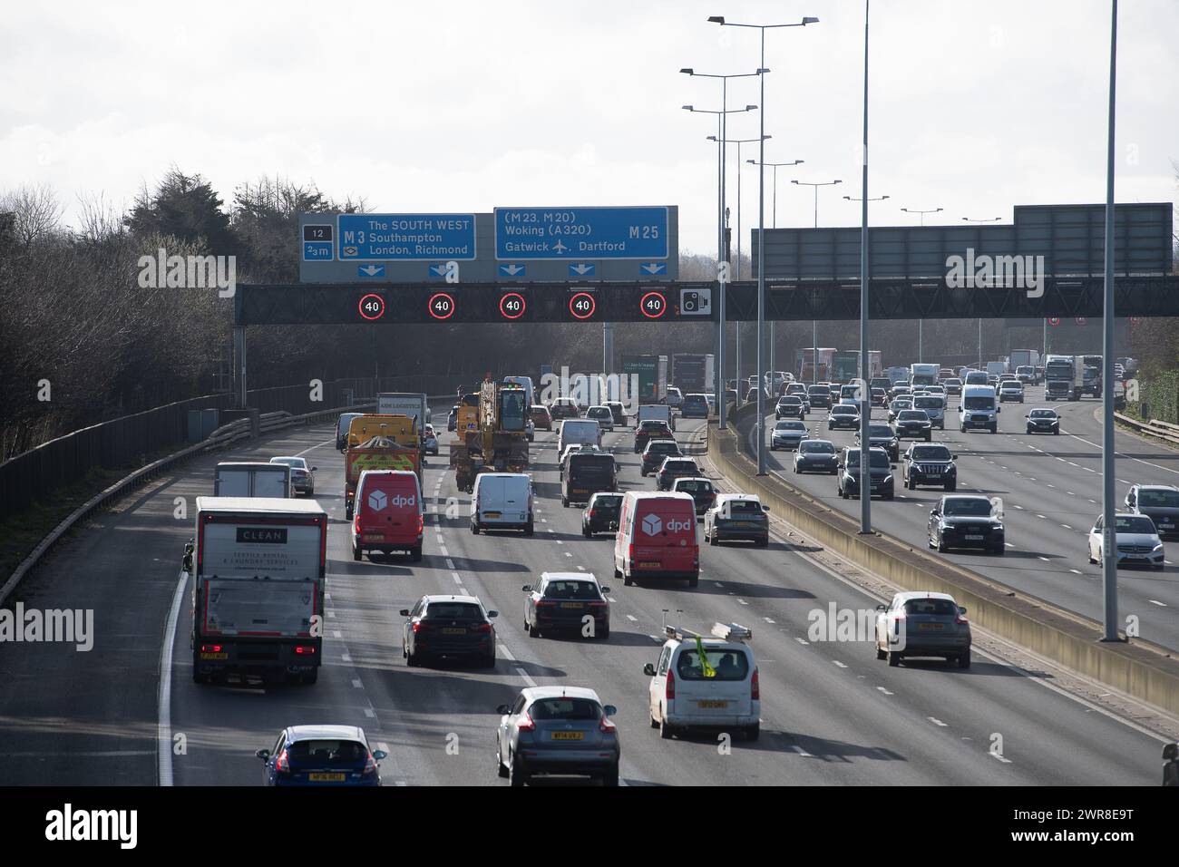 Egham, Surrey, UK. 4th March, 2024. Busy traffic on the M25 Motorway at ...