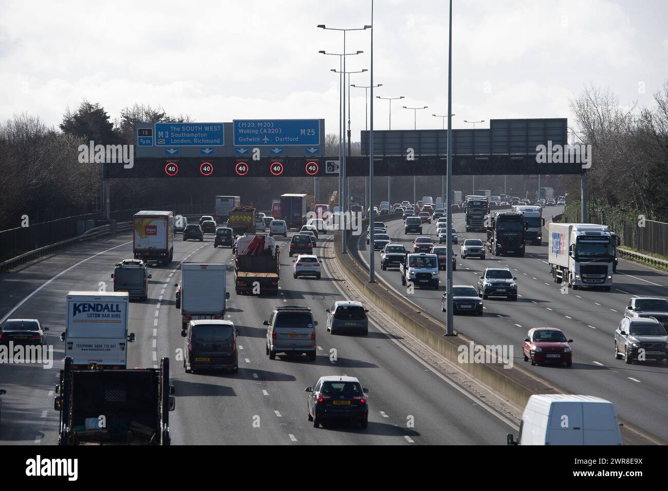 Egham, Surrey, UK. 4th March, 2024. Busy traffic on the M25 Motorway at ...