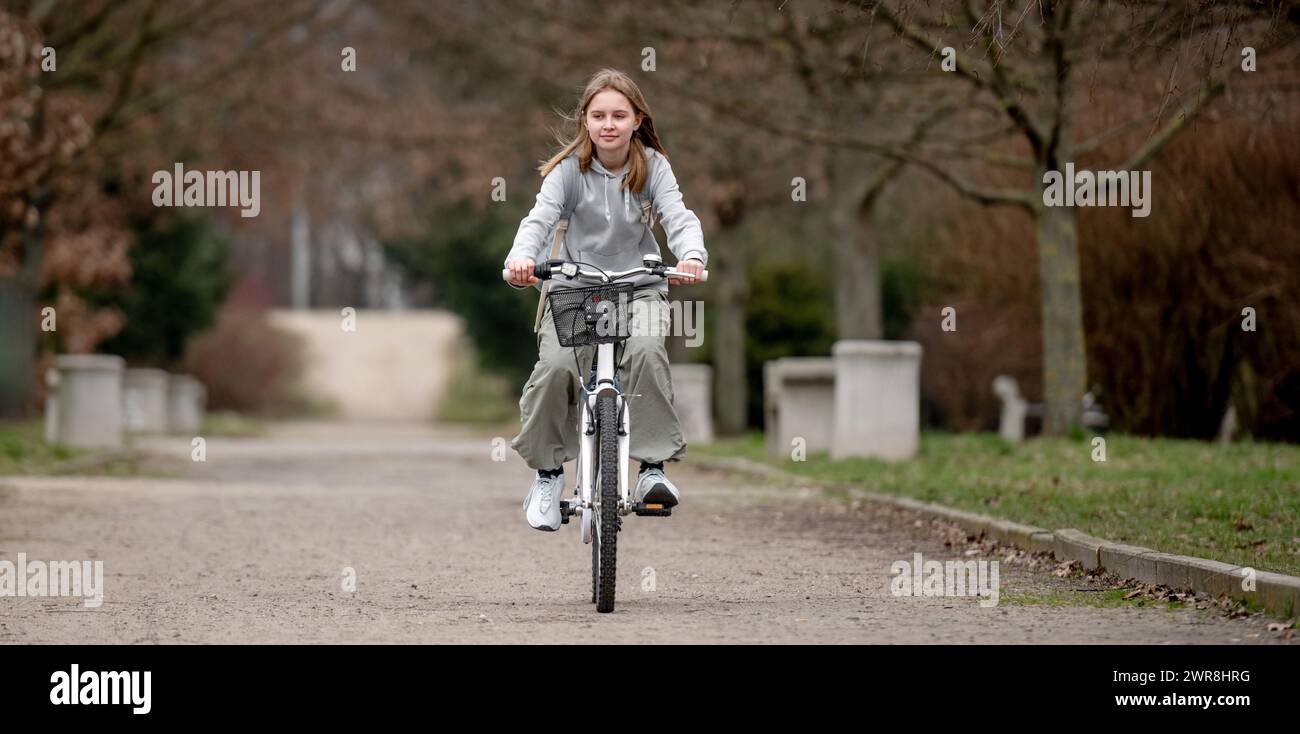 Warm Weather Sees Girl Riding Bicycle Through Spring Park Stock Photo ...