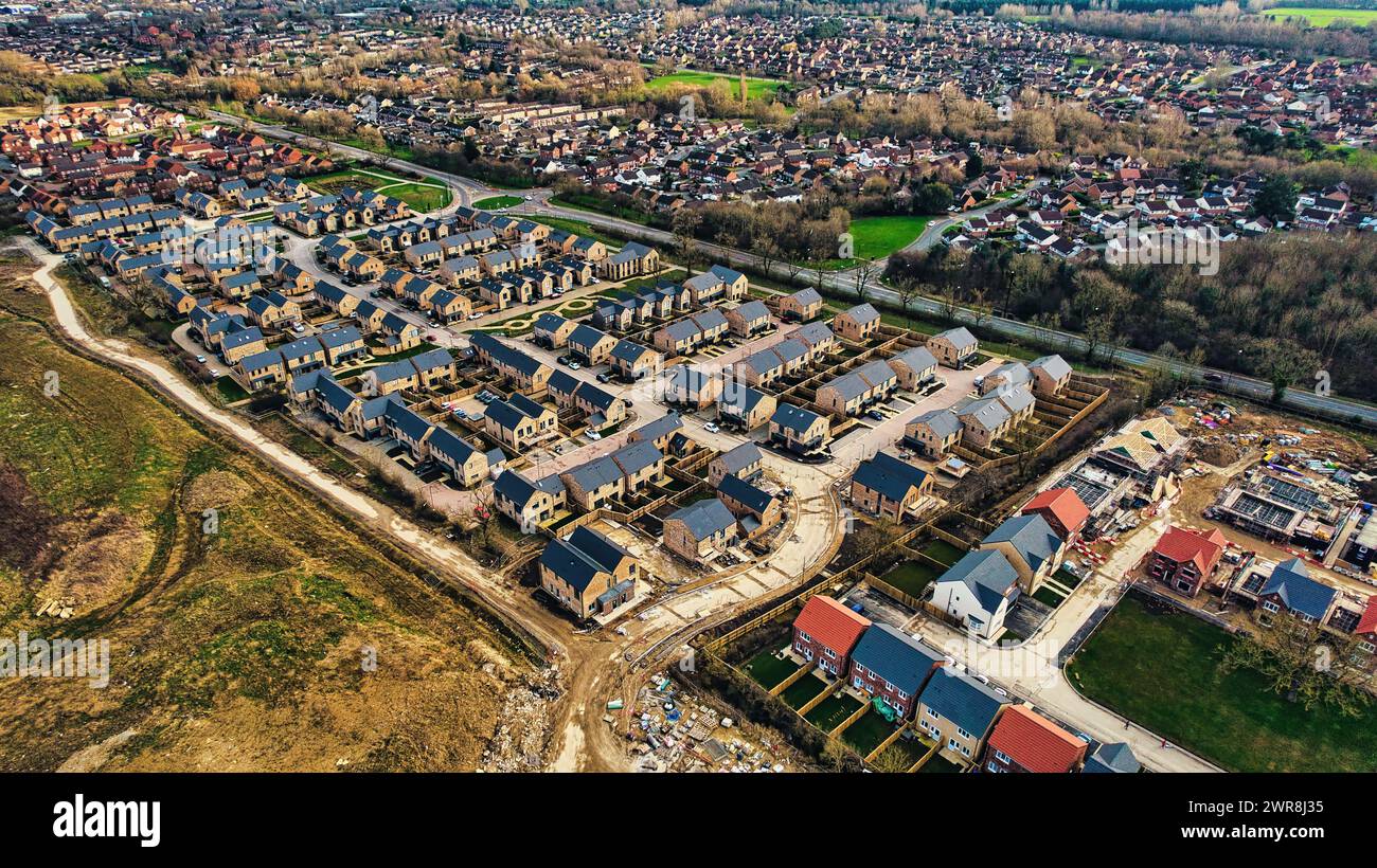 Aerial view of a suburban neighborhood with rows of houses, showing ...