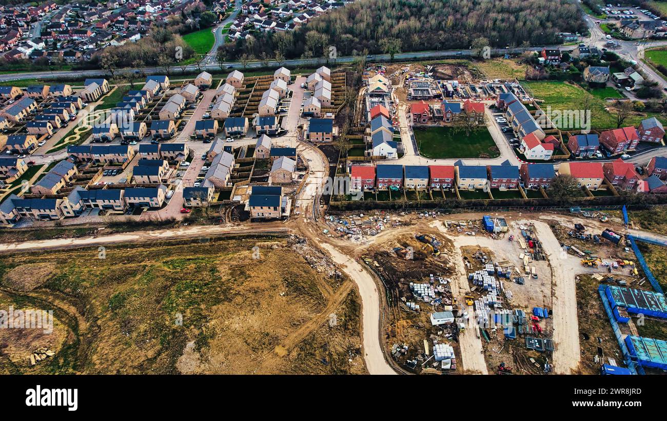 Aerial view of a suburban housing development under construction with ...