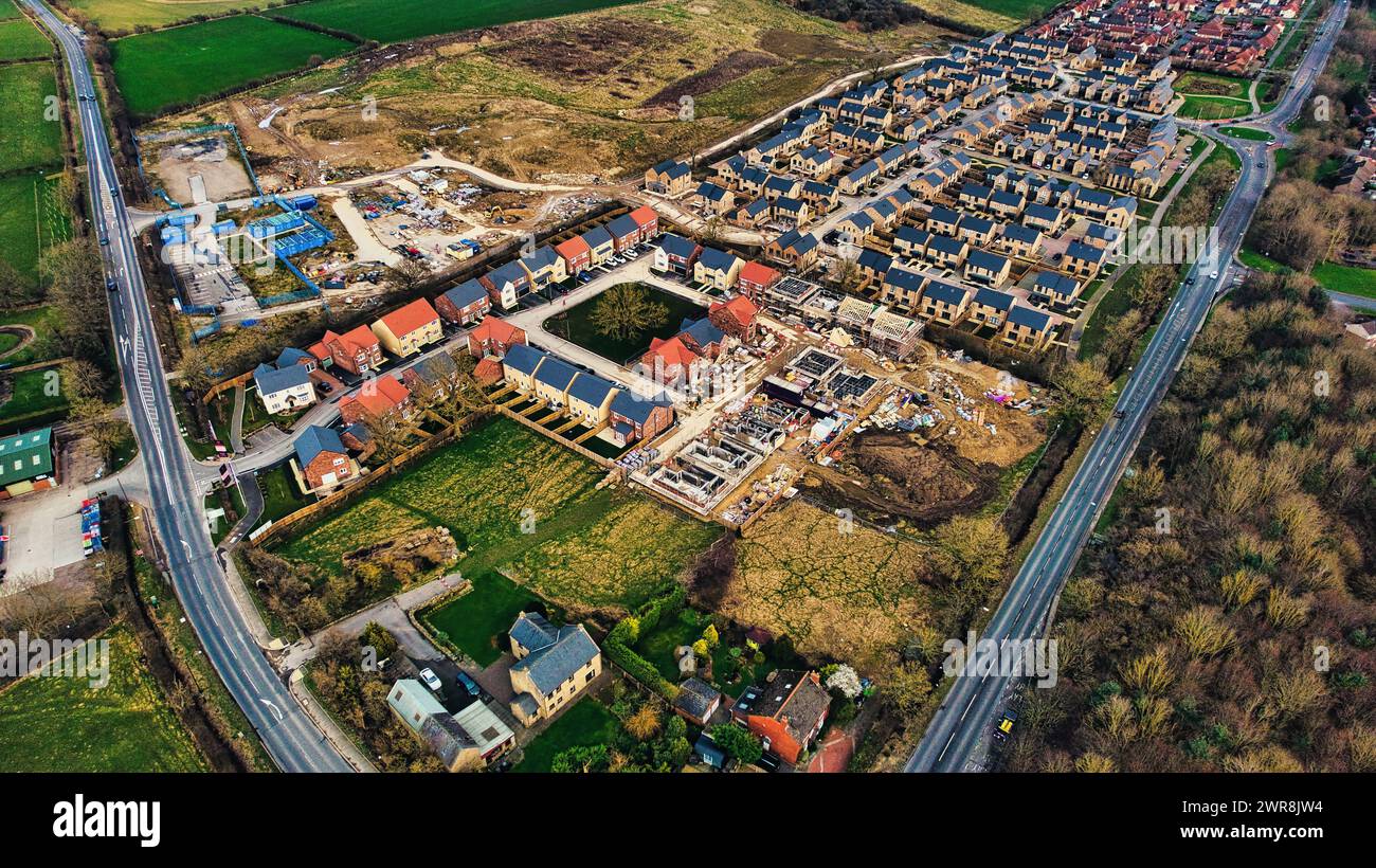 Aerial view of suburban housing development with construction site ...