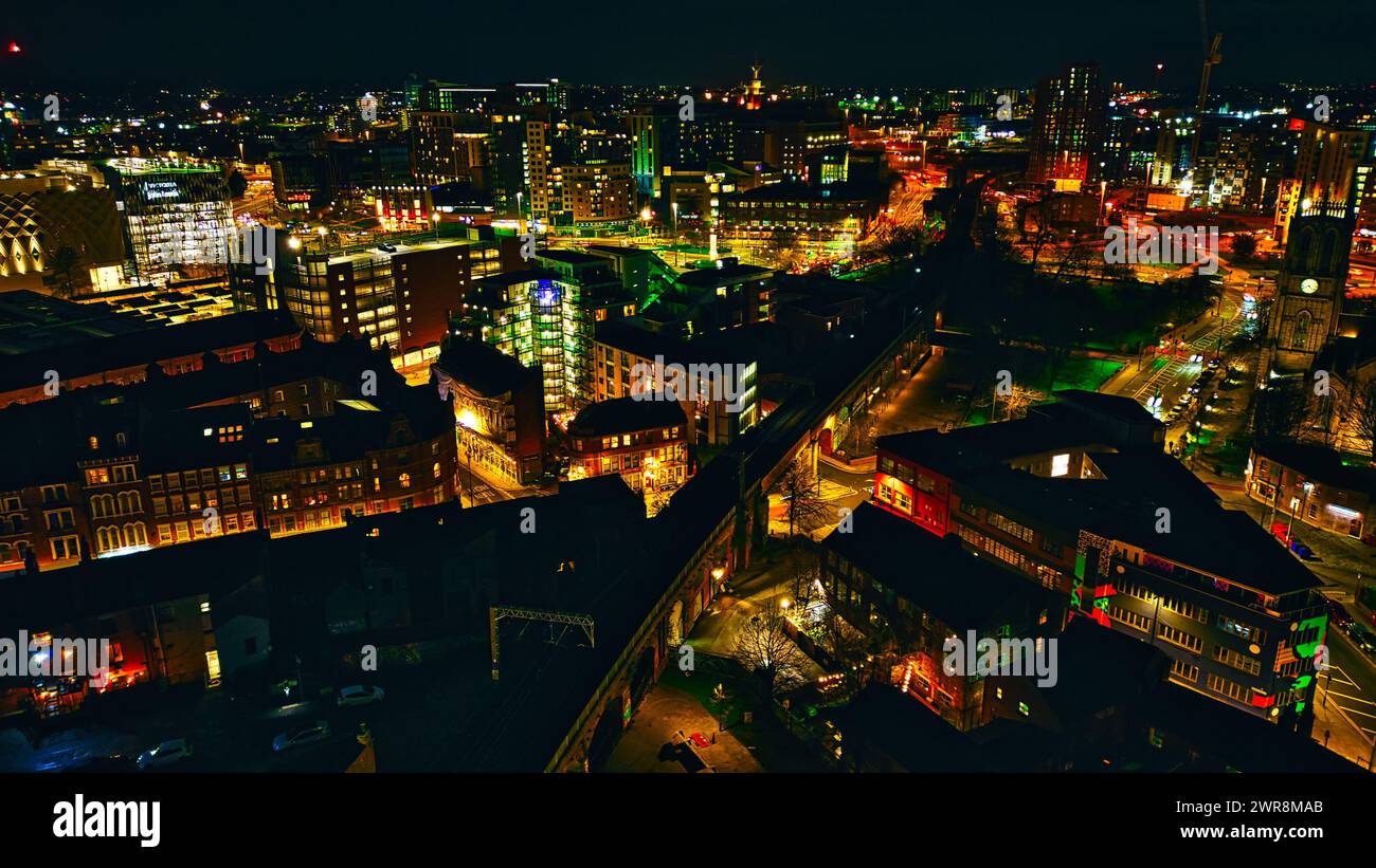 Aerial night view of a vibrant cityscape with illuminated streets and ...