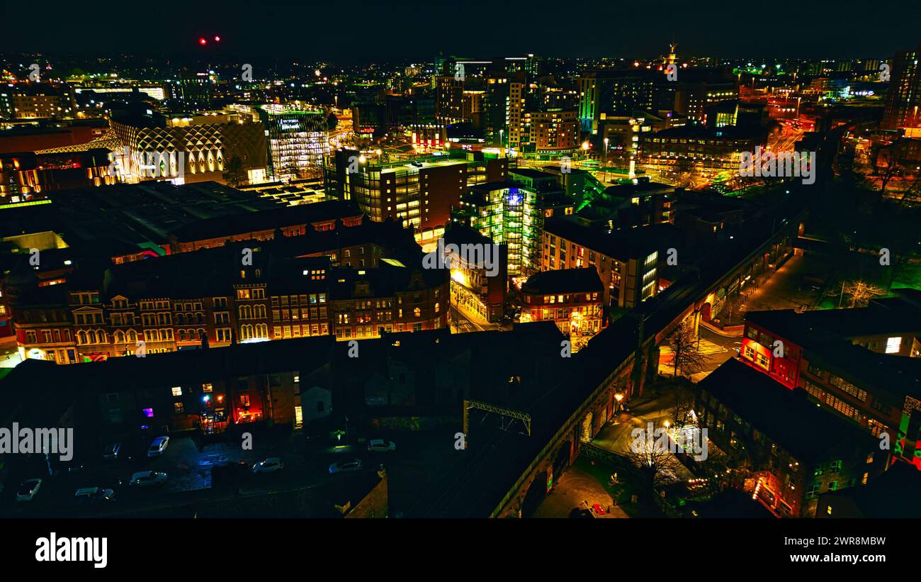Cityscape at night with illuminated buildings and streets in Leeds, UK ...