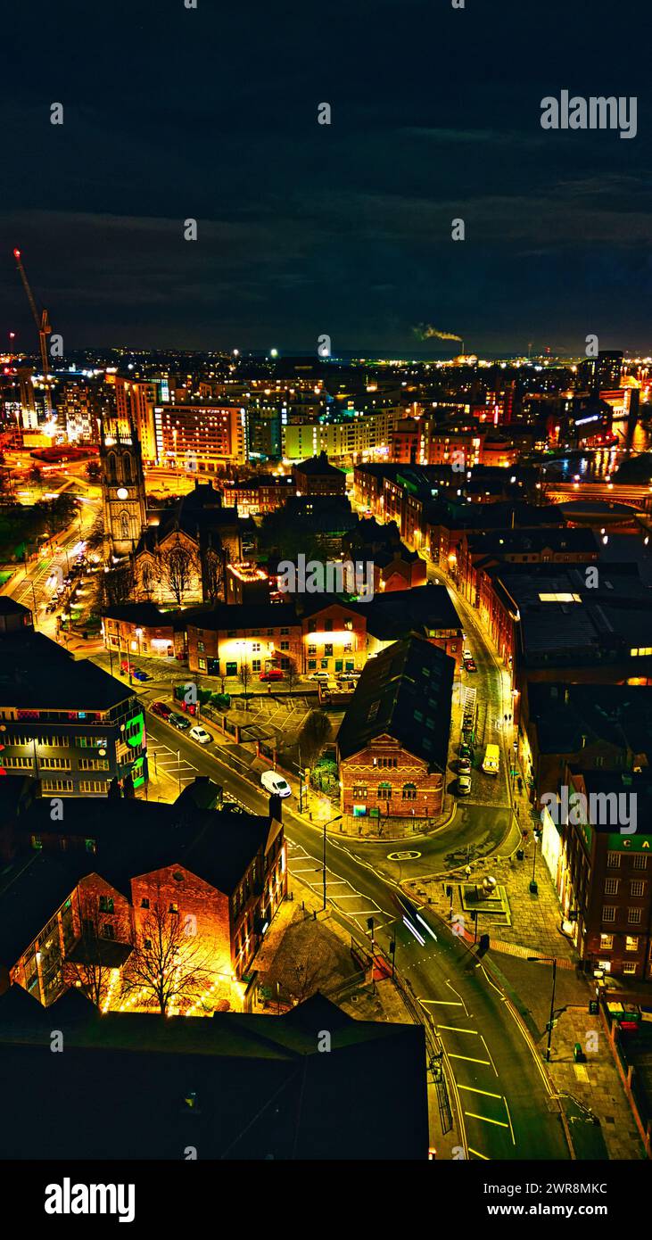 Aerial night view of a cityscape with illuminated streets and buildings ...