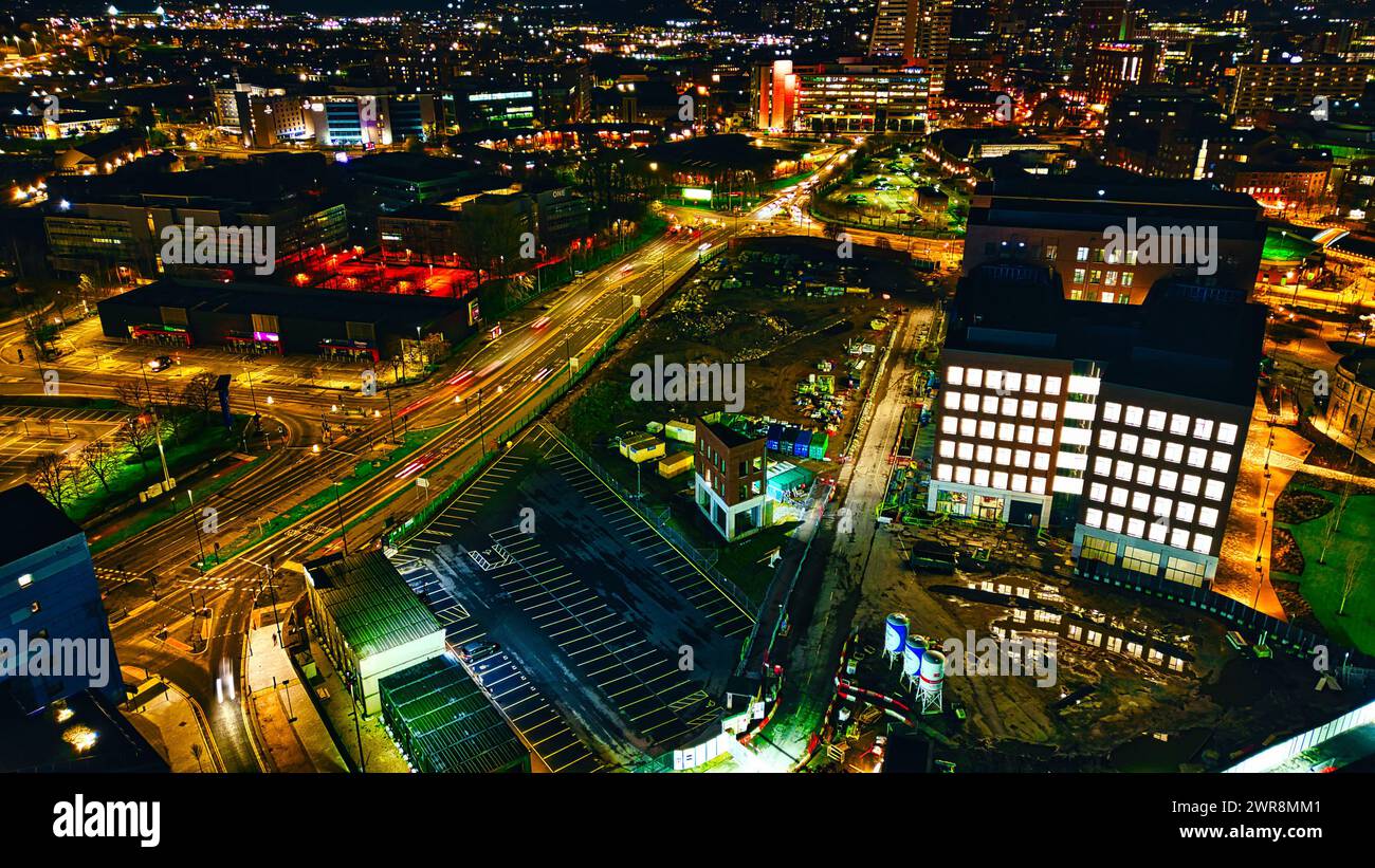 Aerial night view of a vibrant cityscape with illuminated streets and ...