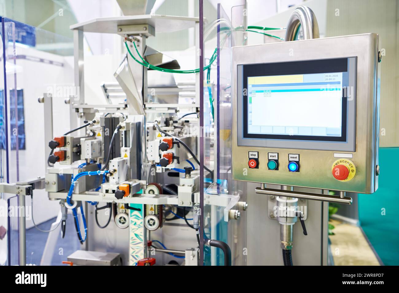 Monitor control panel of food packing machine at industrial exhibition ...