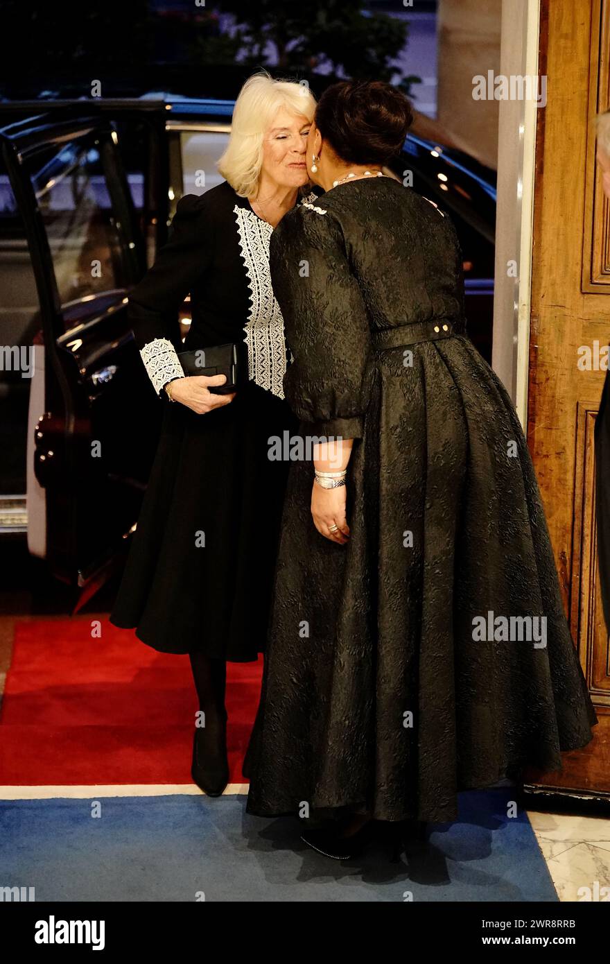 Queen Camilla (left) is greeted by Commonwealth Secretary General ...