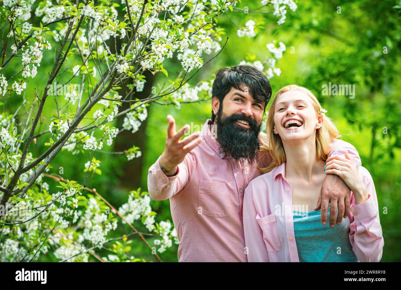 Farmars couple enjoy spring nature and take care about her plants ...